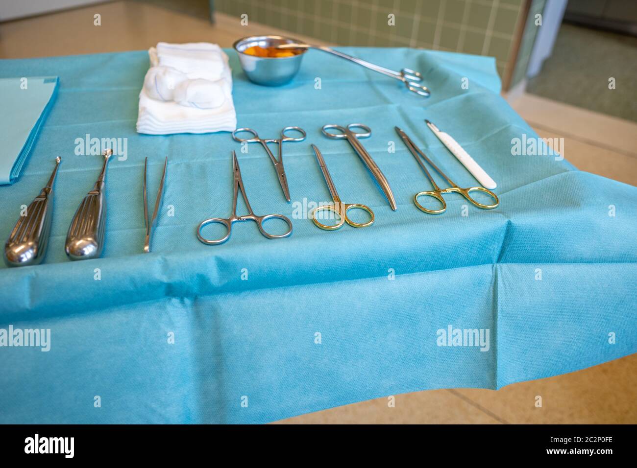 in an operating room there is an instrument table for performing wound ...