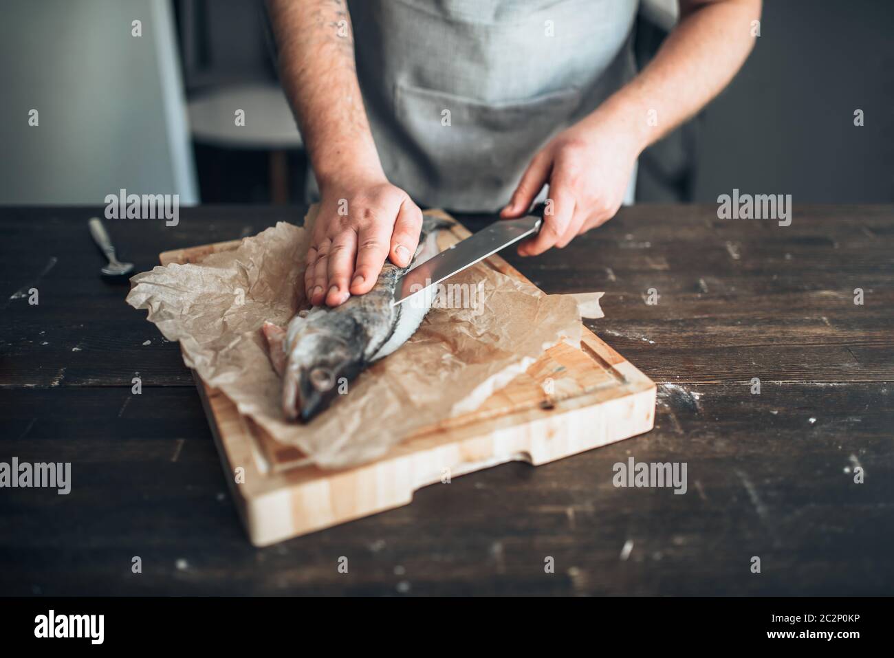 Hand cutting sea bass fillet hi-res stock photography and images - Alamy