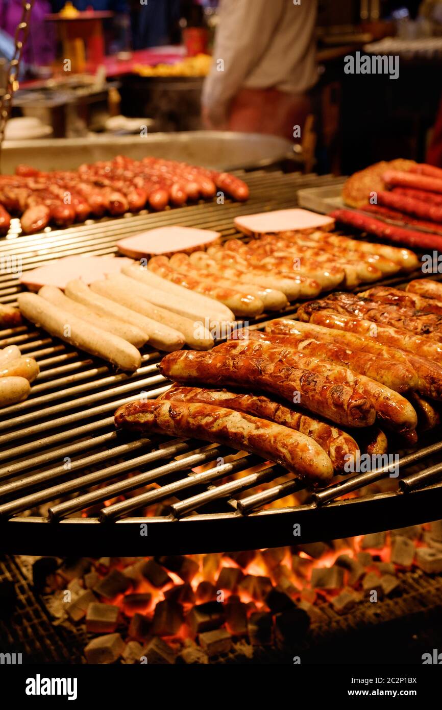 Large round barbecue of sausages and grilled meat Stock Photo - Alamy