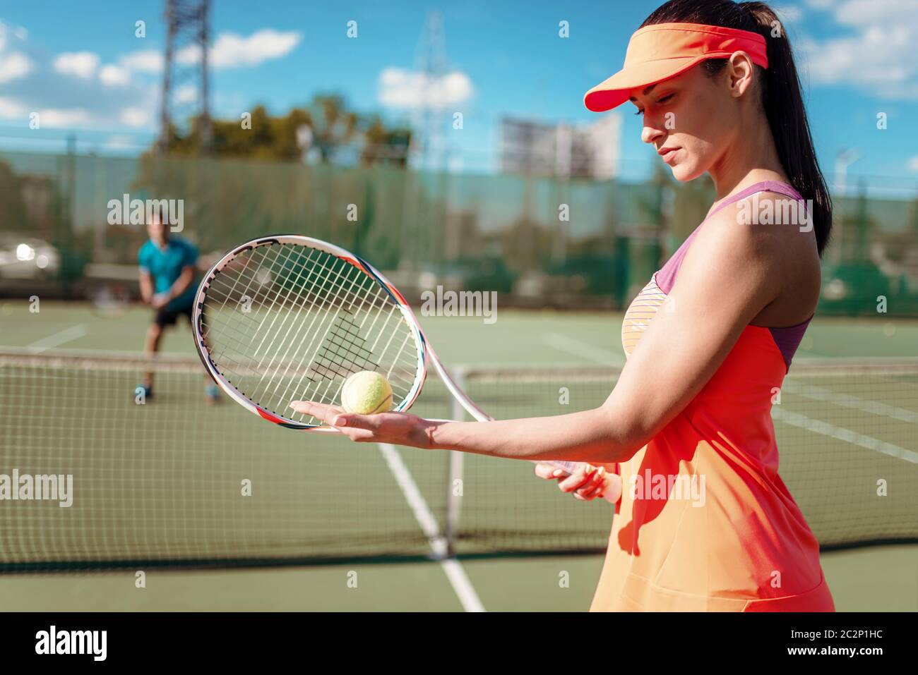 Couple playing tennis on outdoor court. Summer season active sport game ...