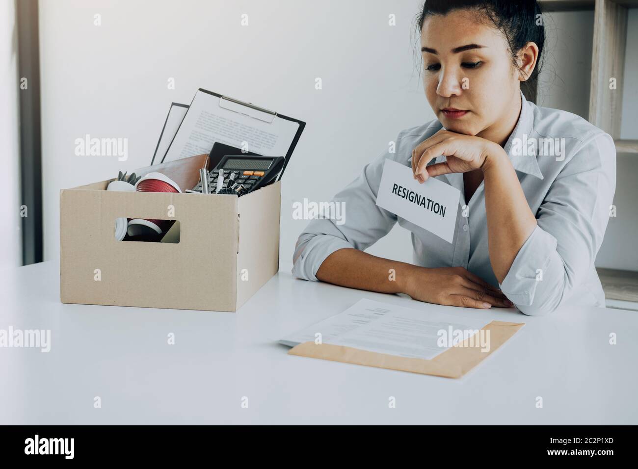 Female employee is about to submit a resignation at his office Stock ...