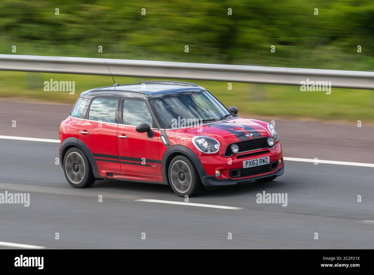 2013 red Mini Countryman Cooper S All4. Vehicular traffic moving ...