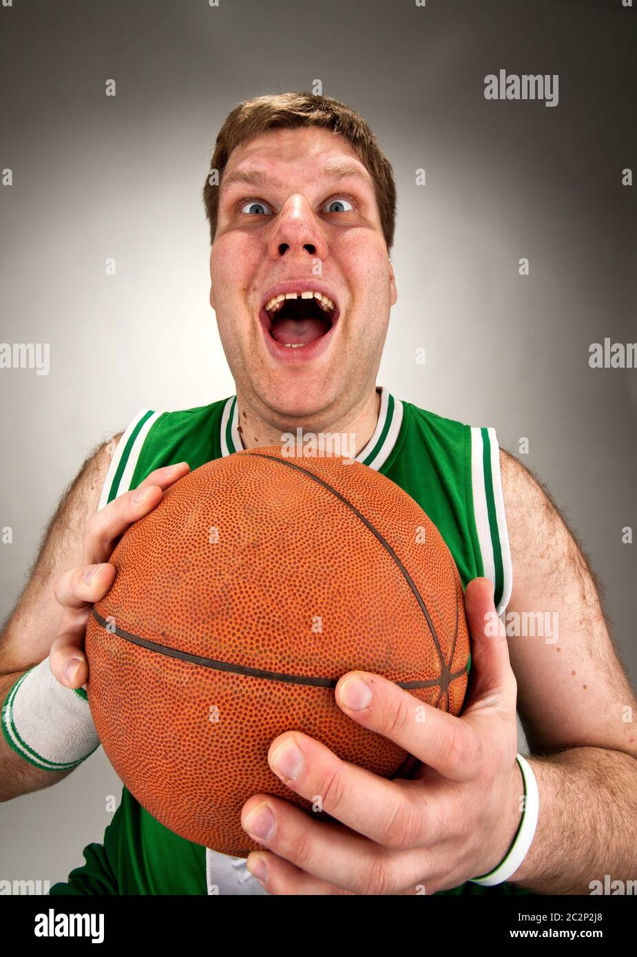 Portrait of bizarre basketball player with ball Stock Photo - Alamy