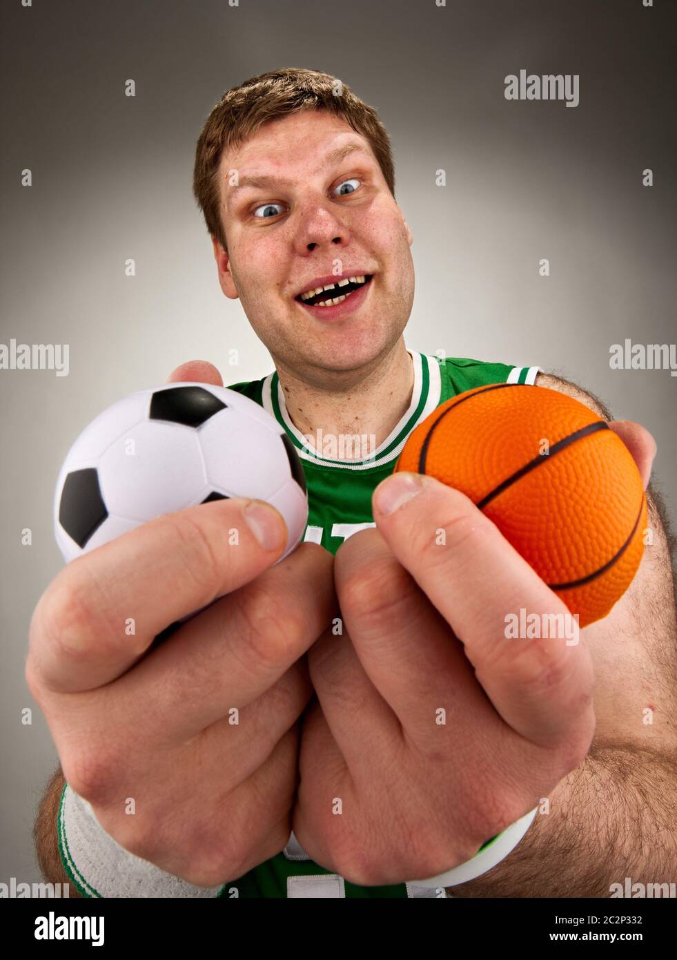 Portrait of surprised basketball player with two balls Stock Photo - Alamy