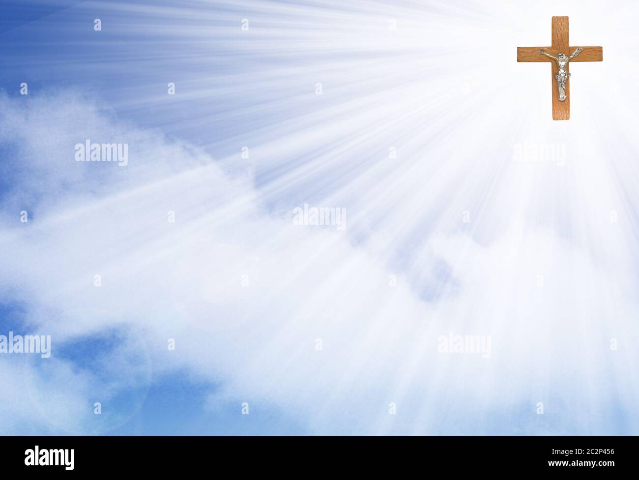 Crucifix in the rays of light Stock Photo - Alamy