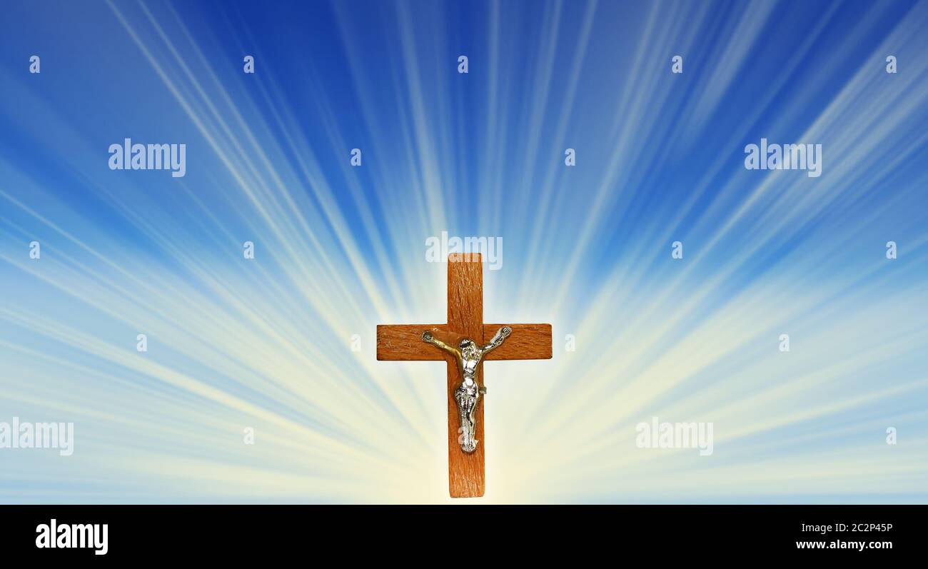 Crucifix in the rays of light Stock Photo - Alamy