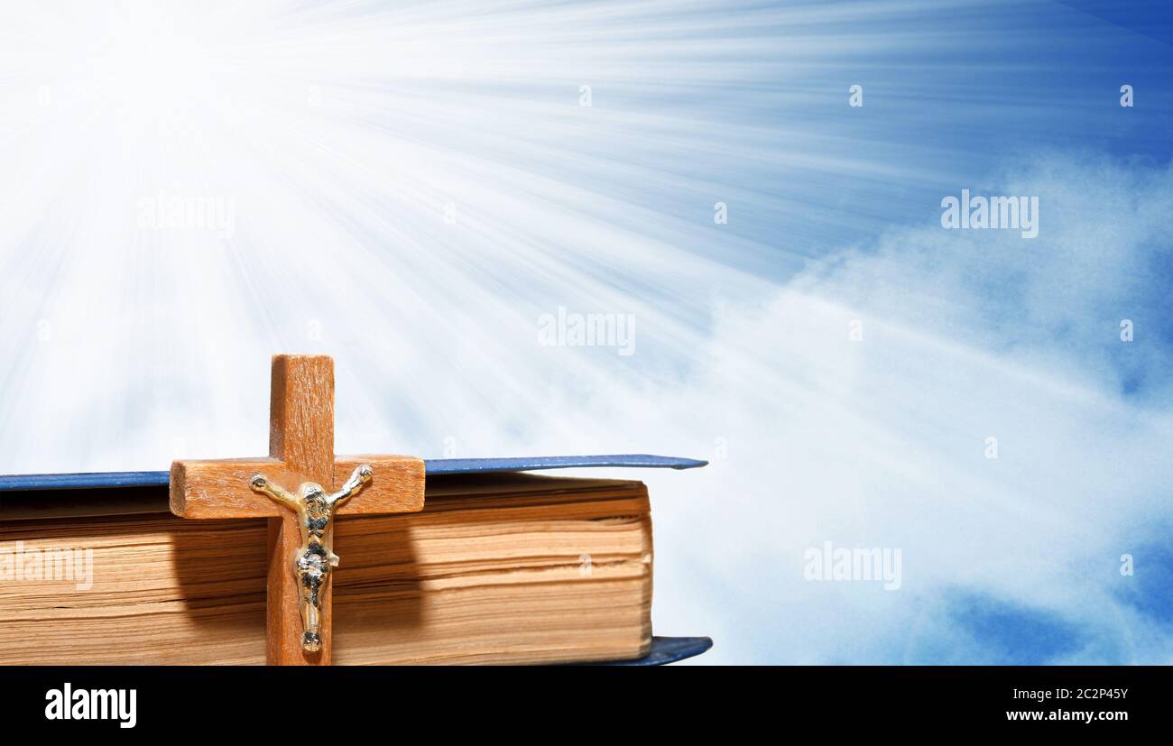 Book and a wooden cross Stock Photo - Alamy