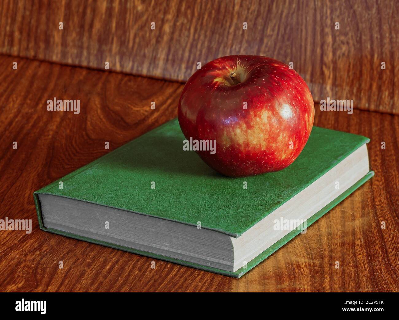 Apple and book Stock Photo - Alamy