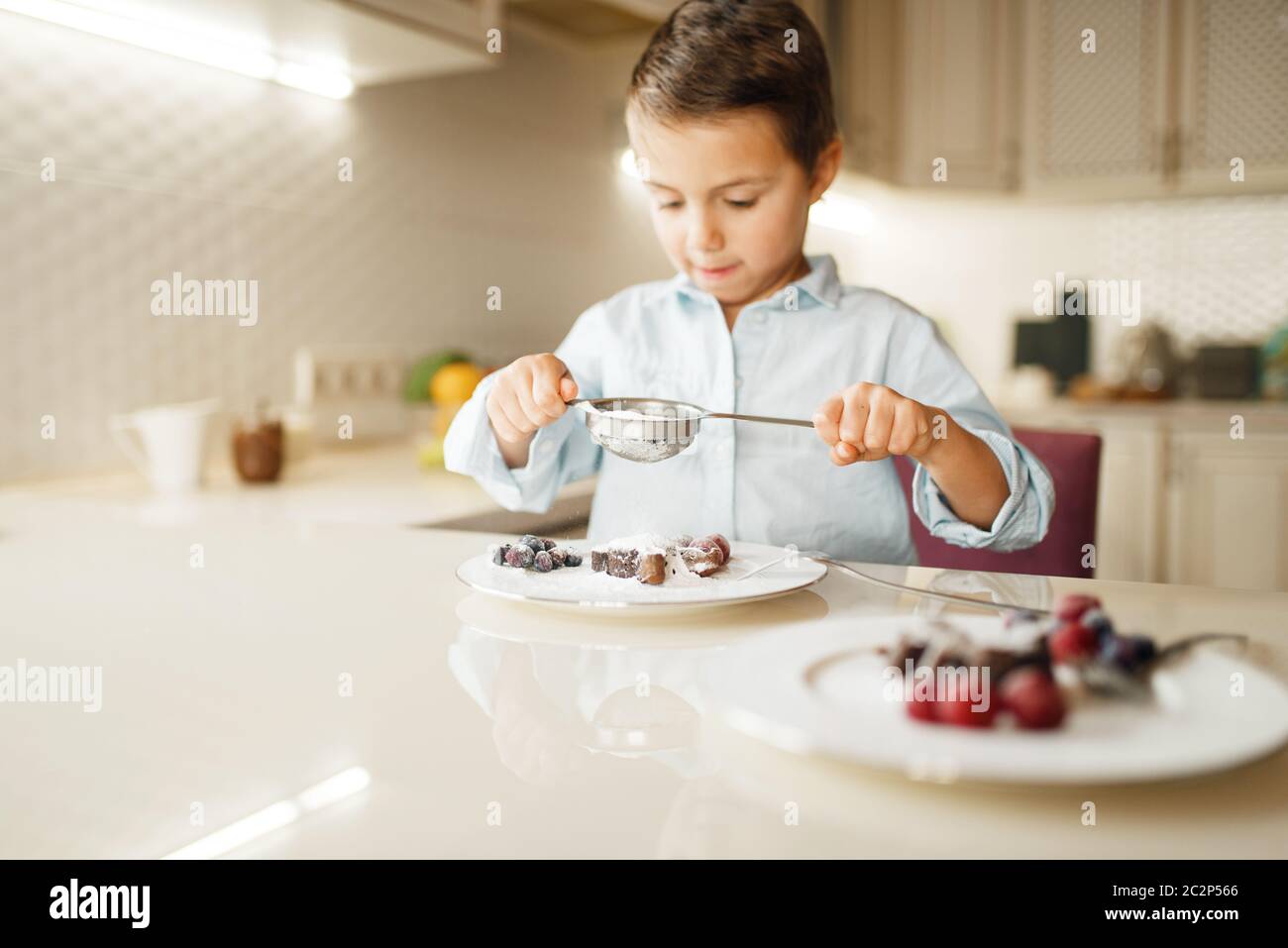 Young boy shows sandwiches with natural melted chocolate. Cute male kid ...
