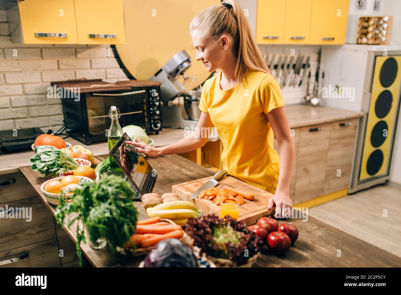Female person cooking on the kitchen, healthy food. Vegetarian diet ...