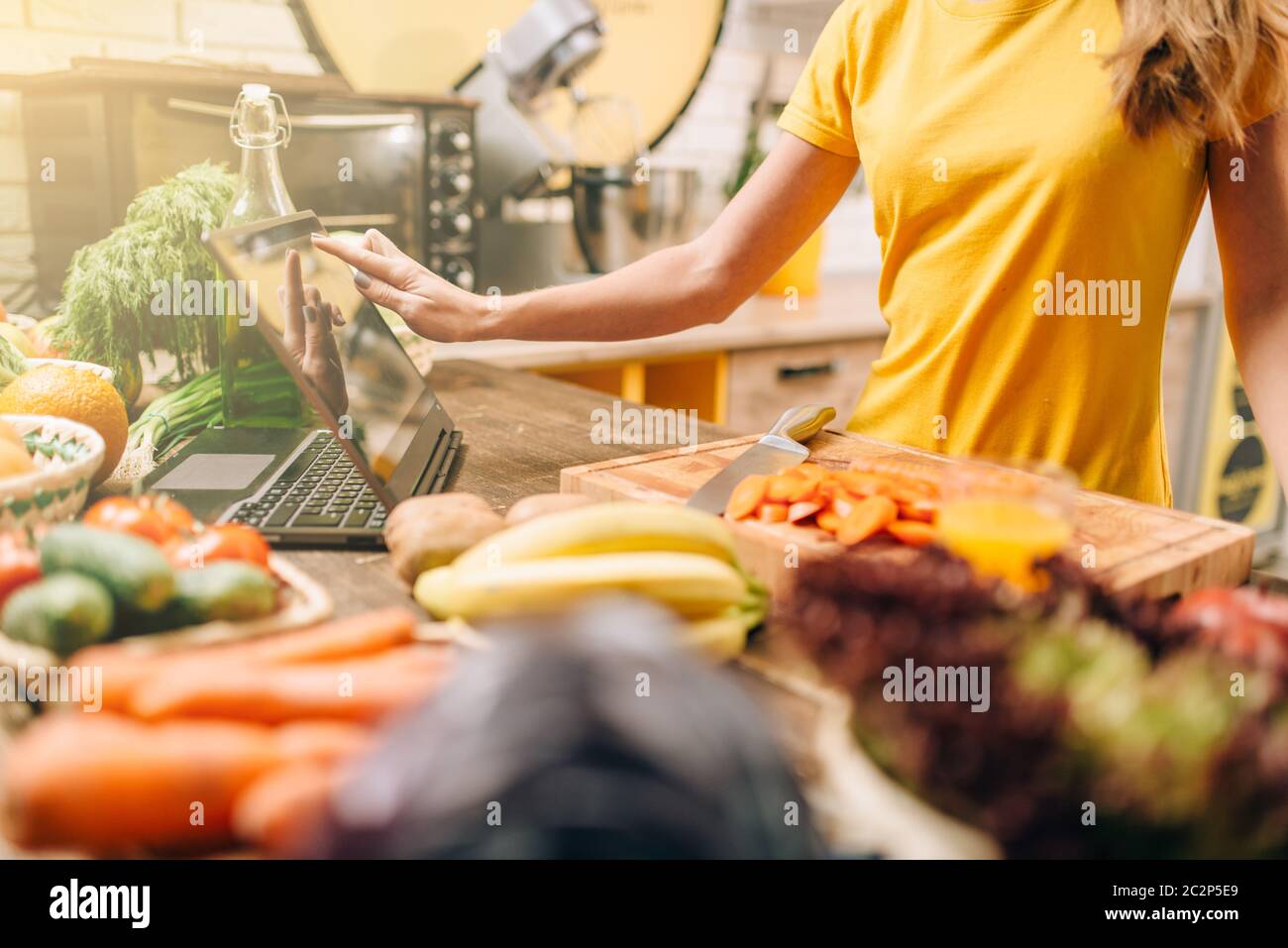 Female person cooking on the kitchen, healthy food. Vegetarian diet ...