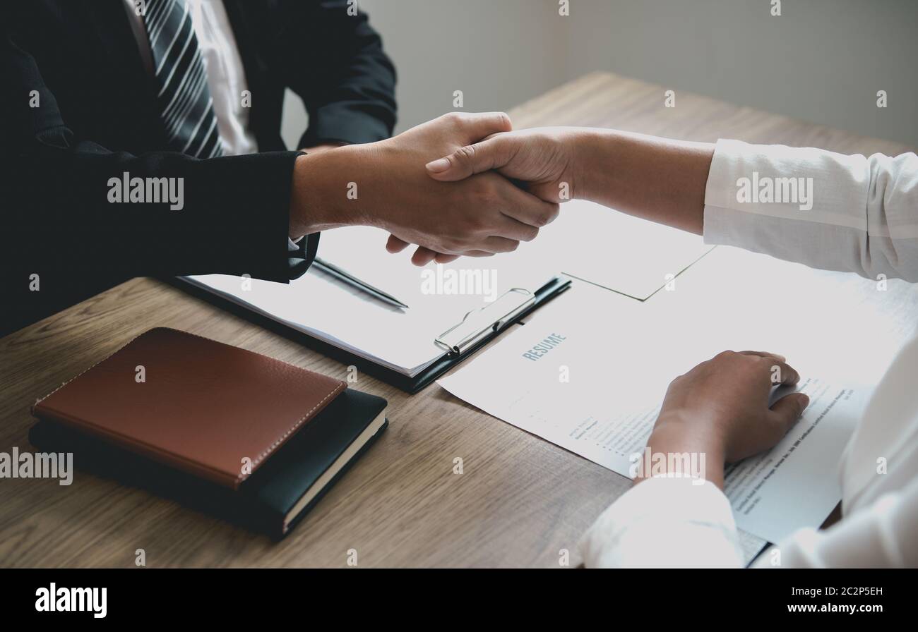 Manager and employee interview concept with handshake after talking ...