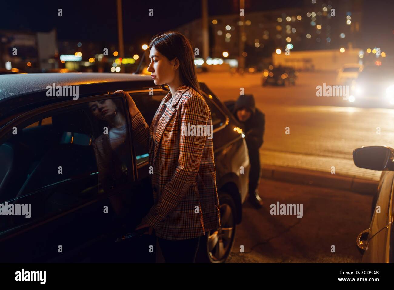 Woman sneaking up on man hi-res stock photography and images - Alamy