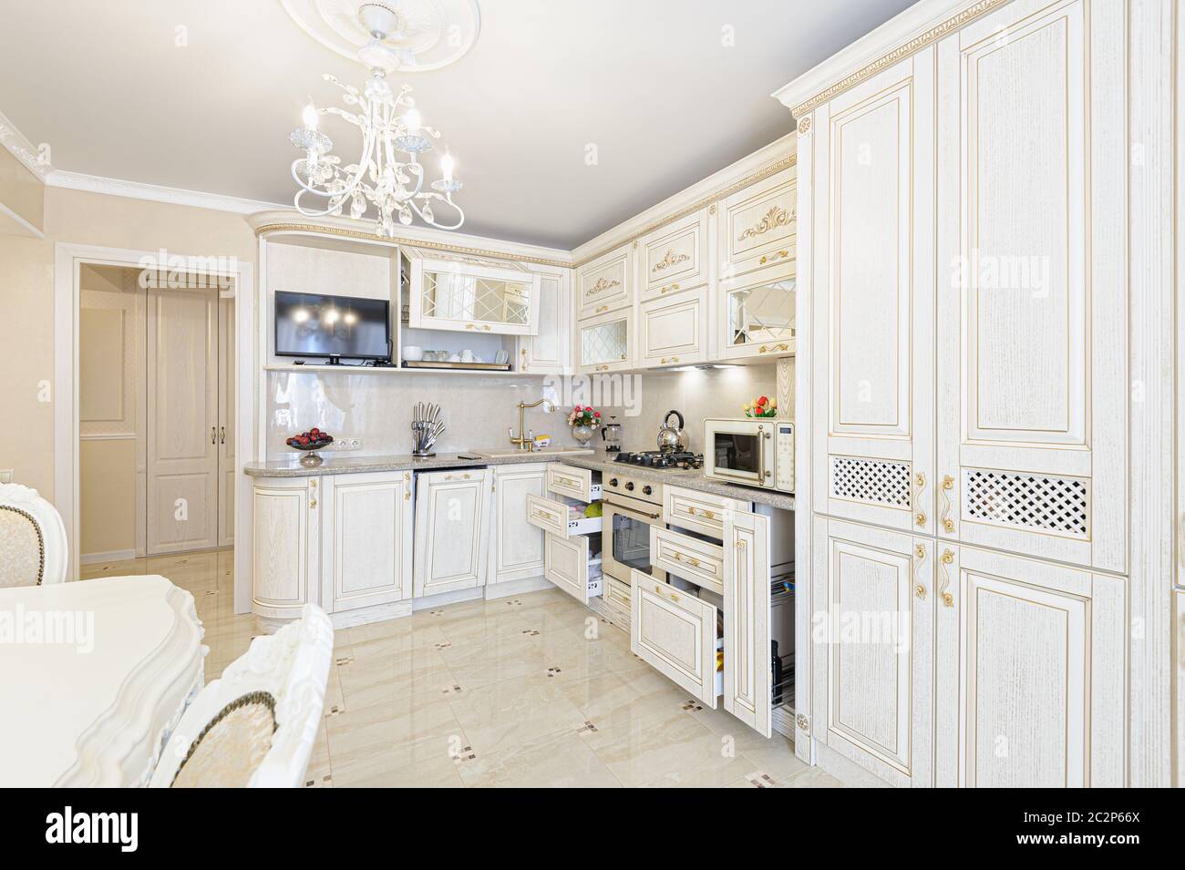 Luxury modern beige and cream colored kitchen interior Stock Photo - Alamy