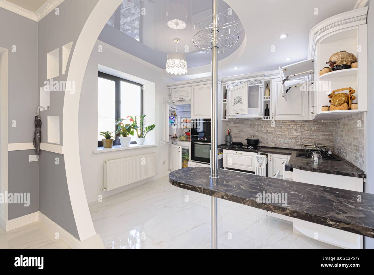 Luxury modern white colored kitchen interior Stock Photo - Alamy