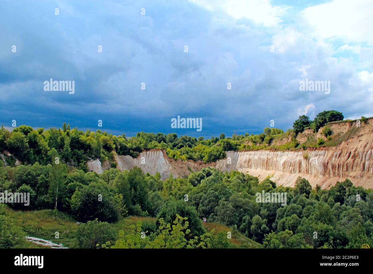 Cretaceous quarry. Landscape with sandy cliffs and thunder storm sky ...
