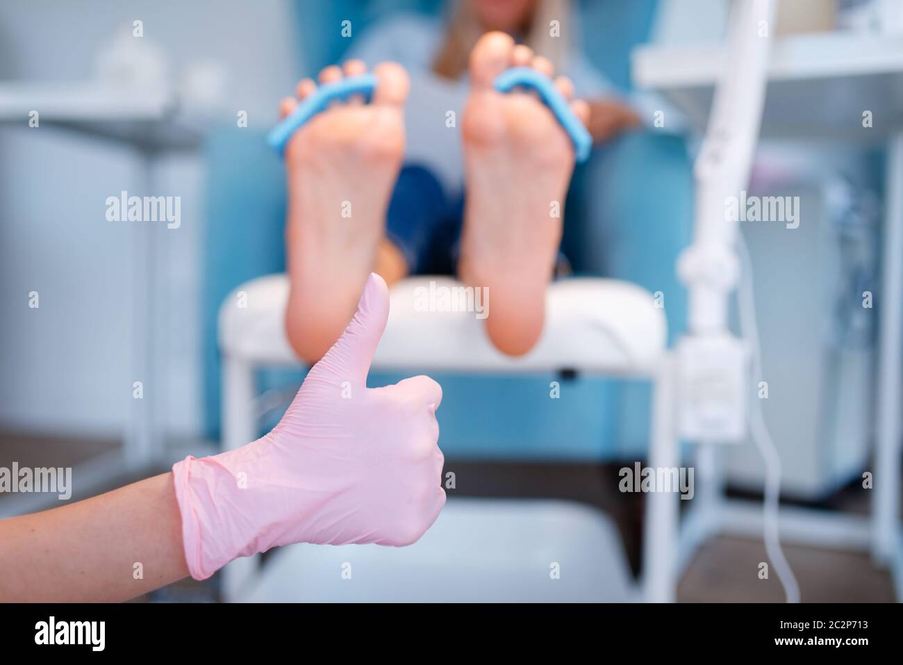 Beautician salon, foot spa procedure. Legs treatment for female client ...