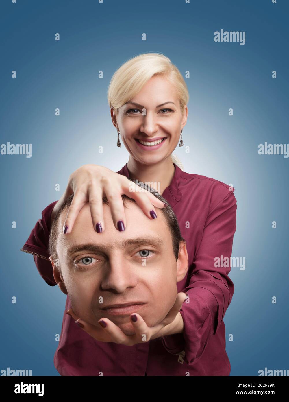 Happy analyst with client's head in her hand Stock Photo - Alamy
