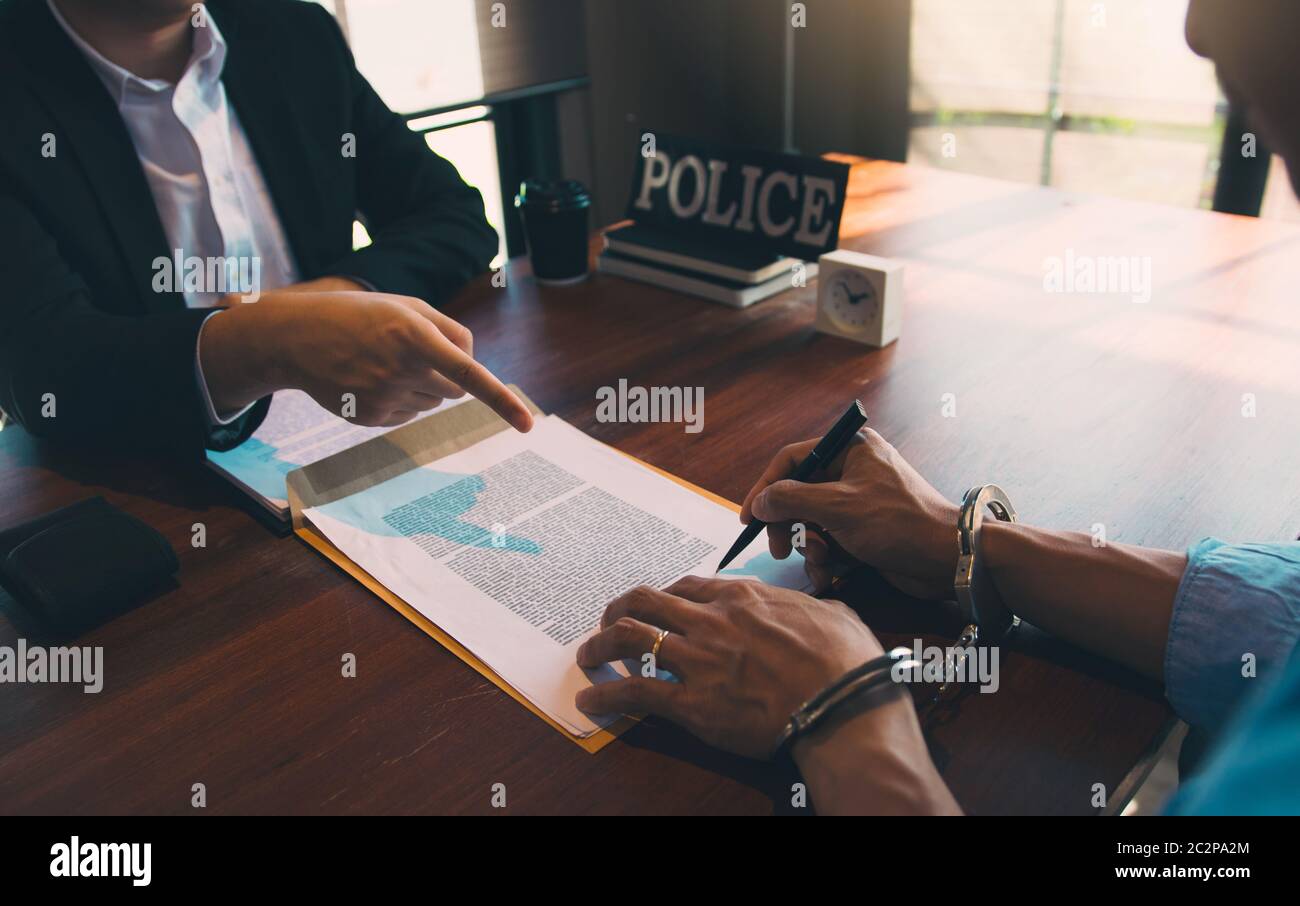 Handcuffed suspect interrogation room hi-res stock photography and ...