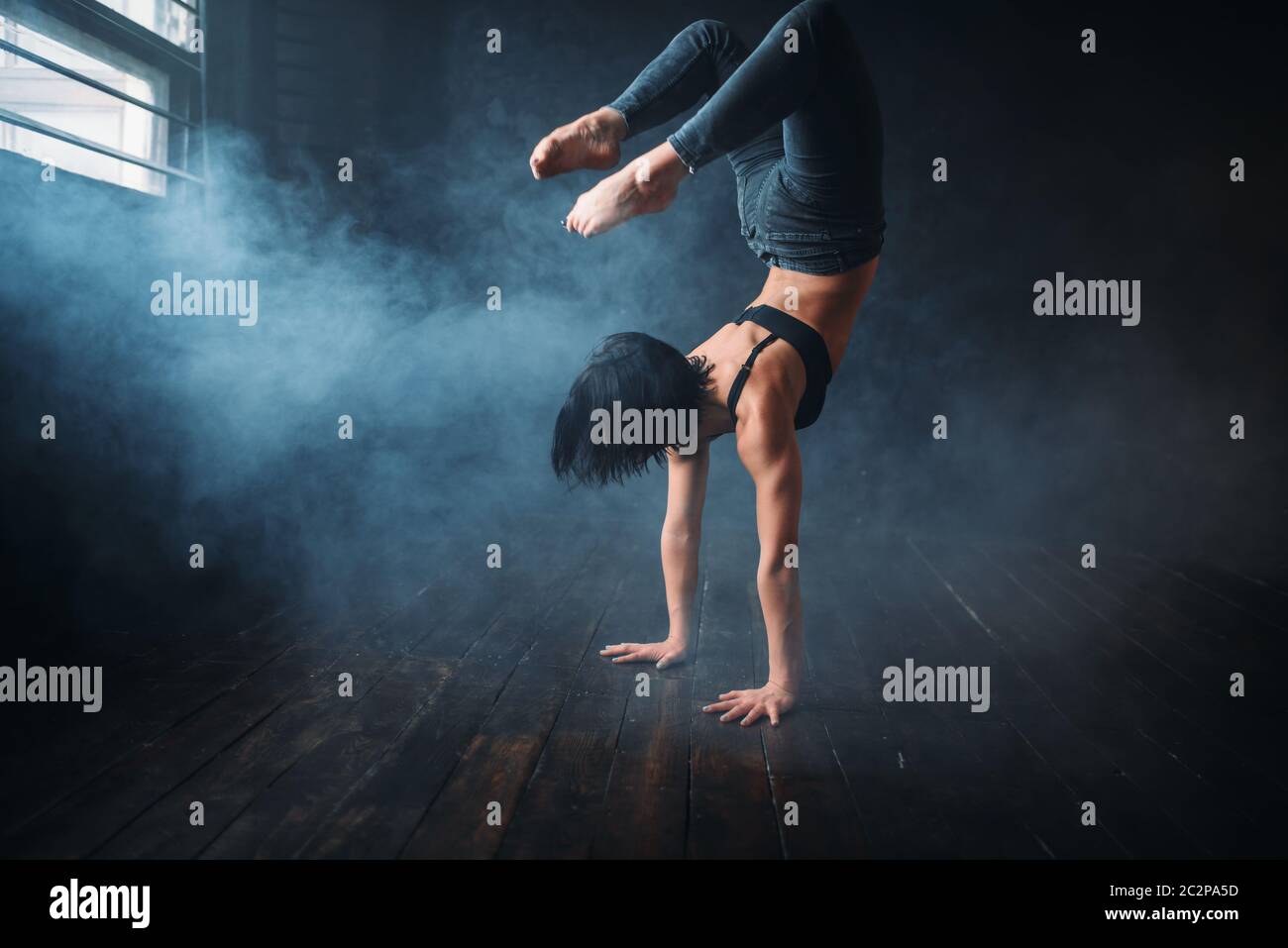 Body flexibility, contemp style dancer in dance class. Female performer ...