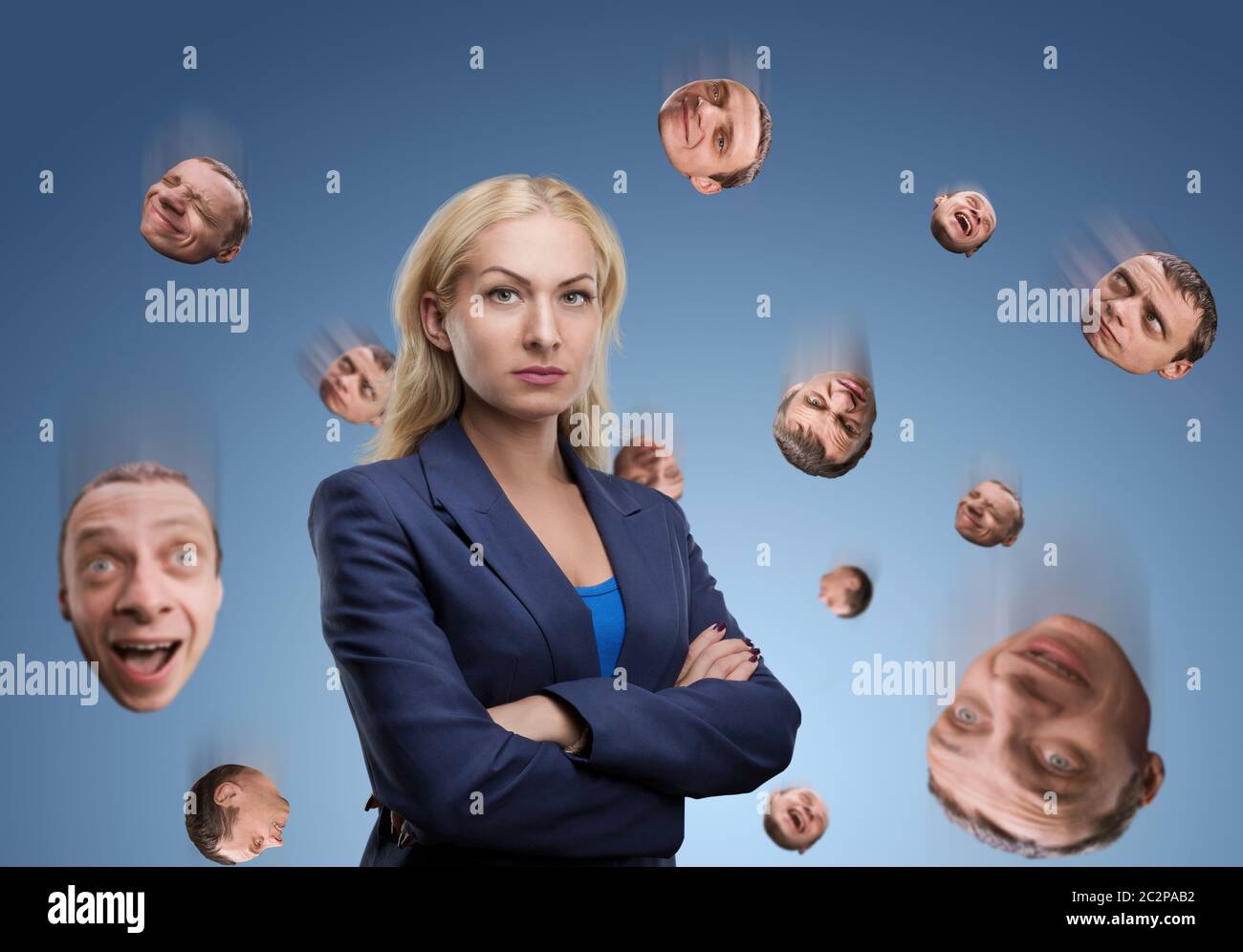 Serious businesswoman with man's head falling around Stock Photo - Alamy