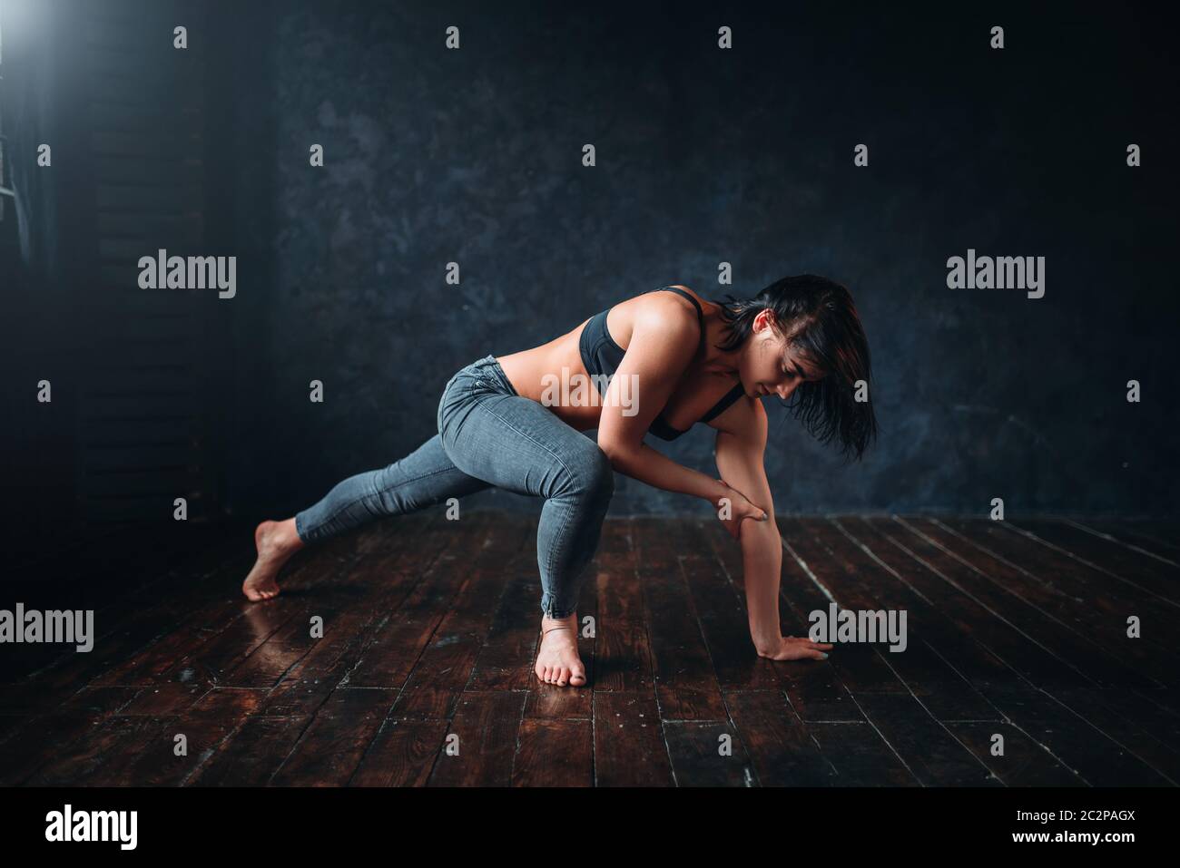 Contemp dancing female performer exercise in dance class. Woman pose in ...