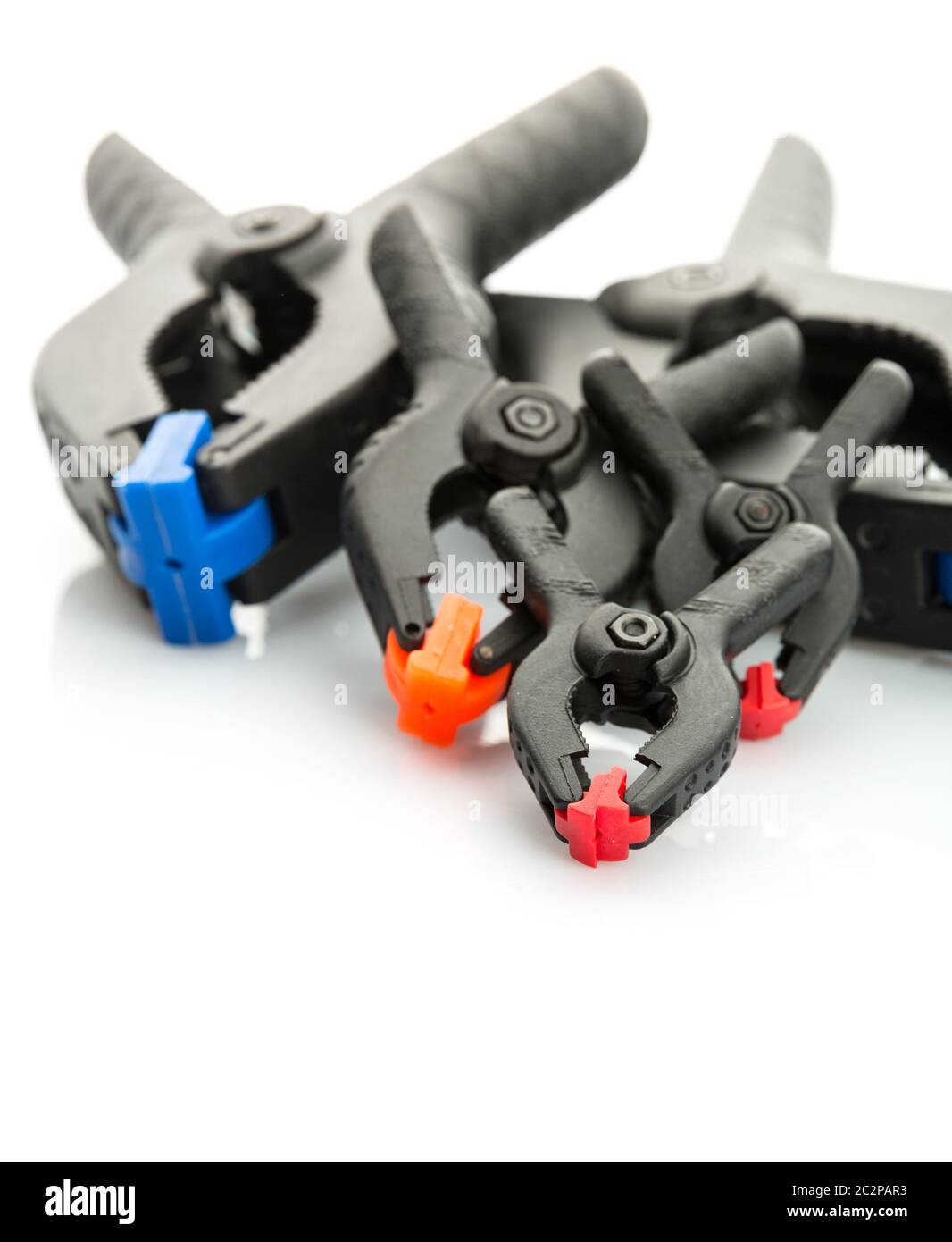 Set of plastic clamps different sizes isolated on white Stock Photo - Alamy