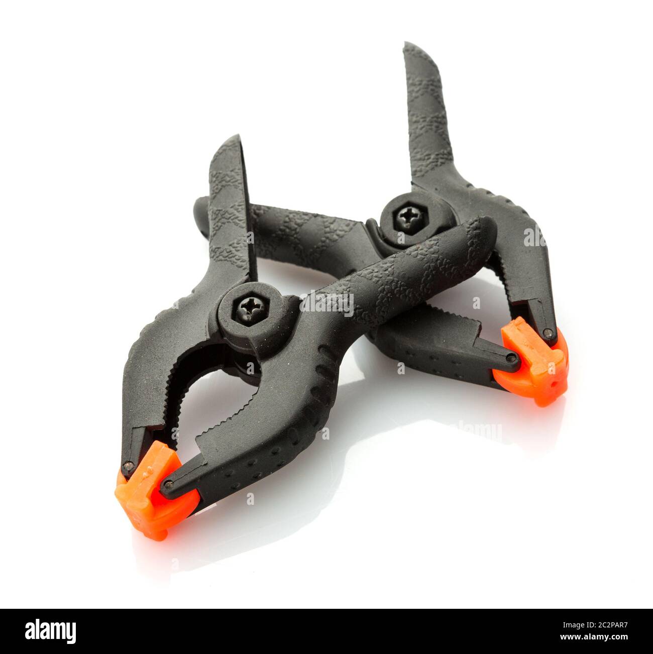 Two plastic clamps isolated on white background Stock Photo - Alamy