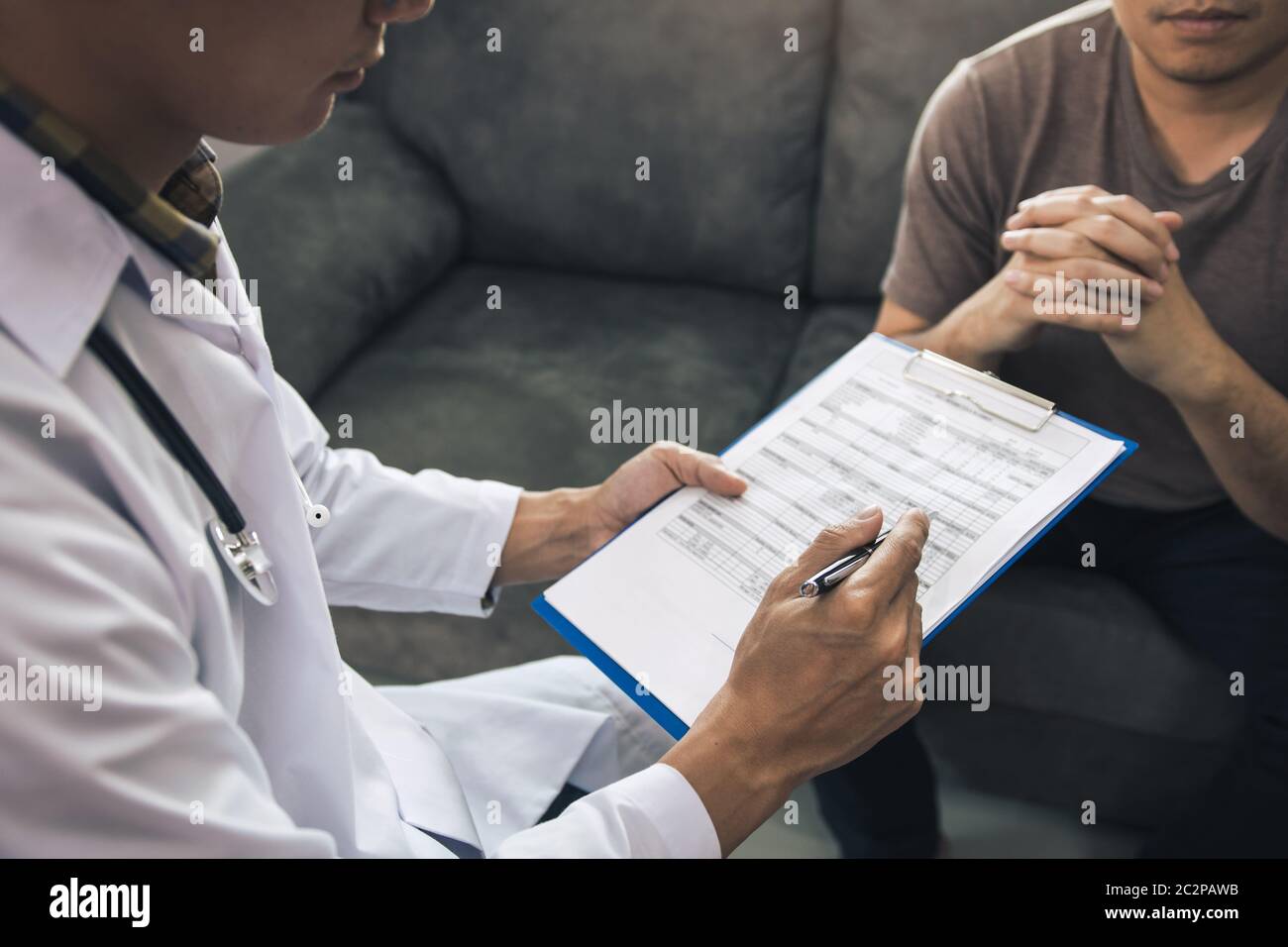 Asian doctor is examining the abnormal items of the body and diagnosing ...