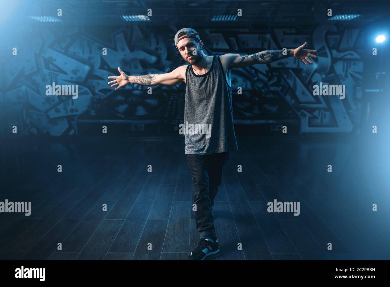 Male rapper in dance studio, trendy lifestyle. Modern urban dancing ...
