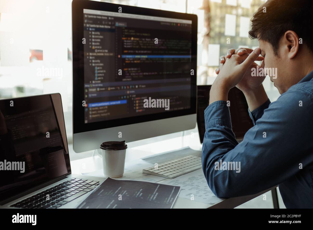 Software developers headache with code analysis in the office Stock ...