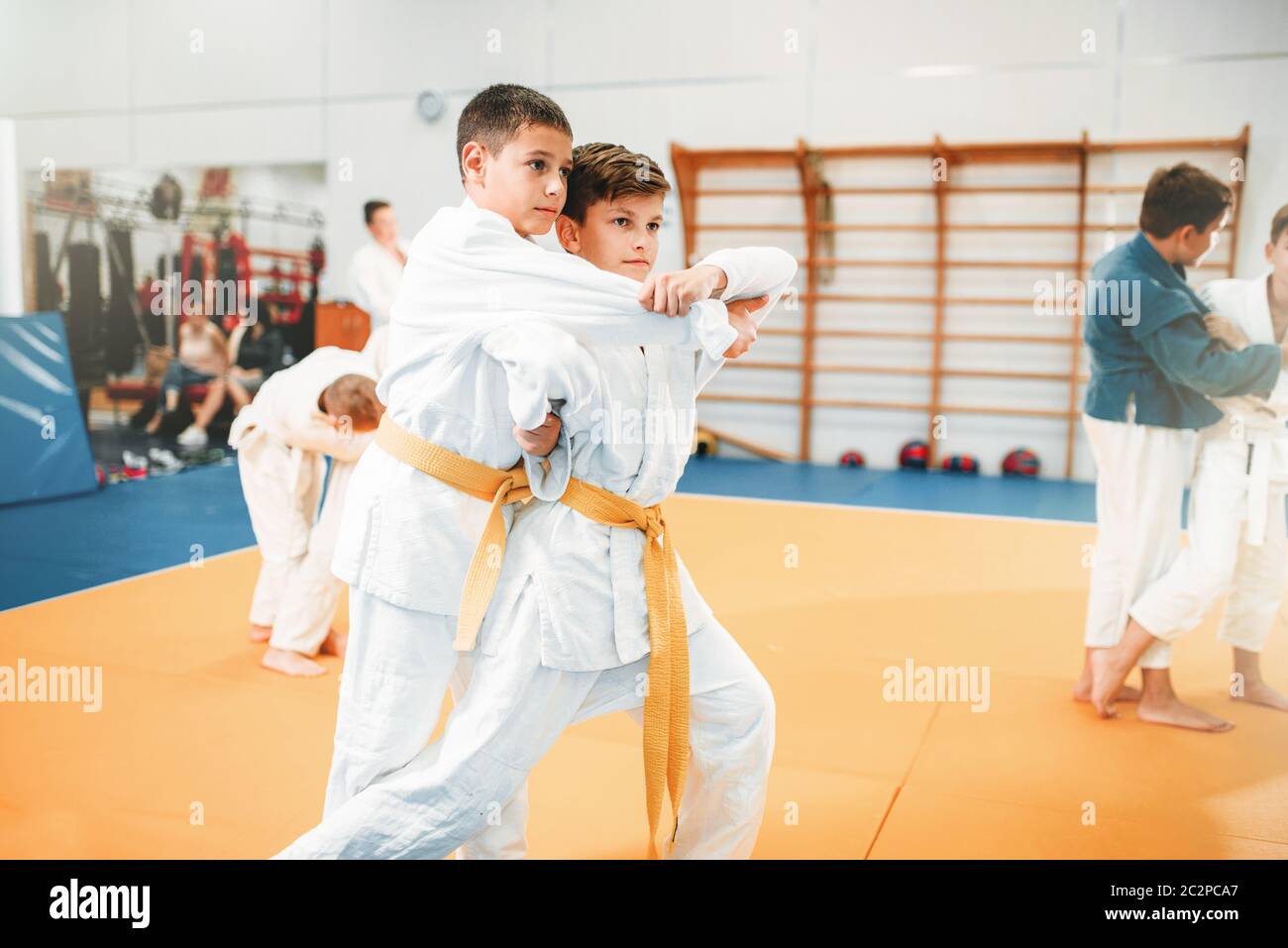 Kid judo, childrens training martial art in hall. Little boys in ...
