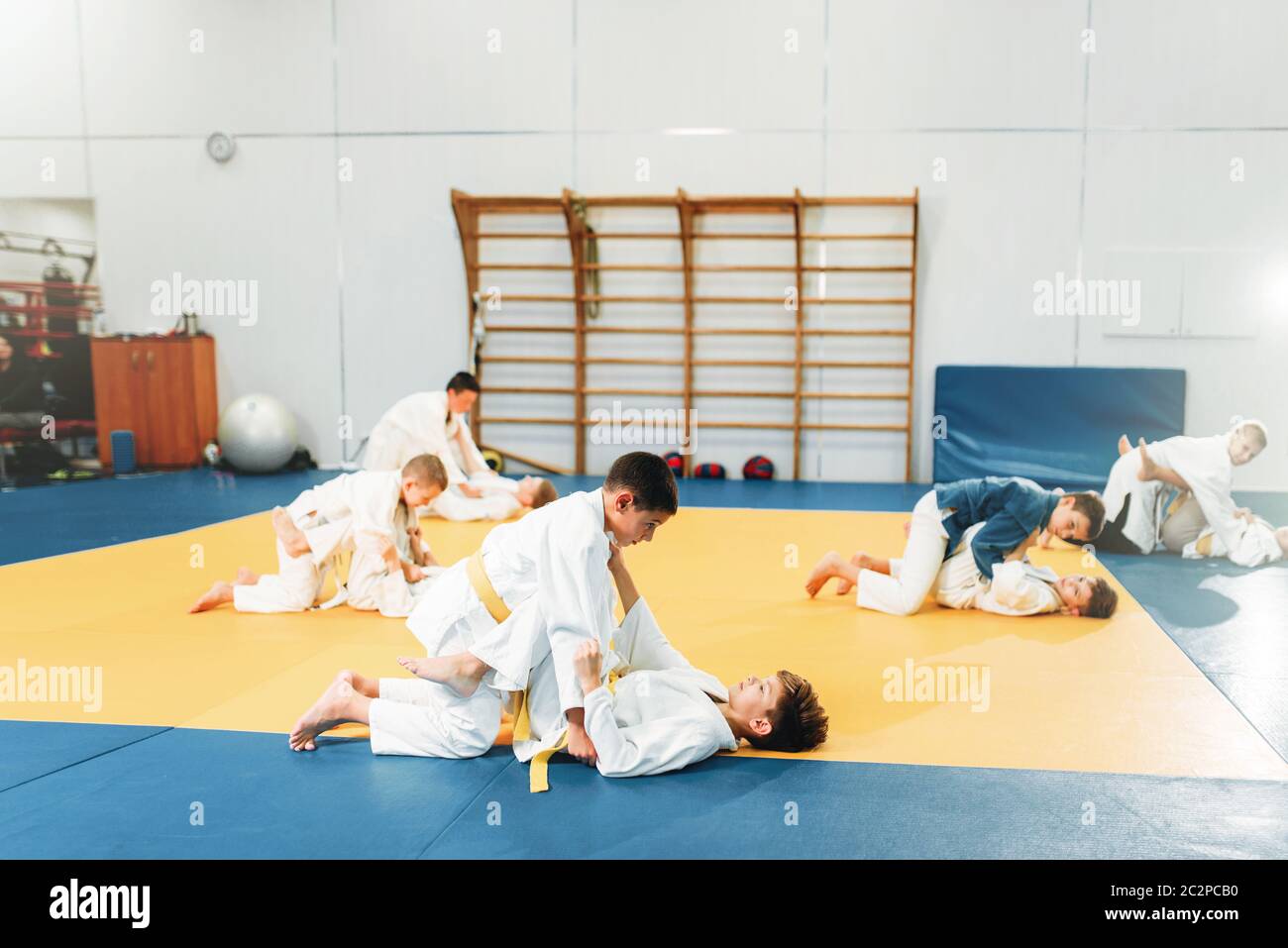 Kid judo, children on fight training, martial art, self-defense. Little ...