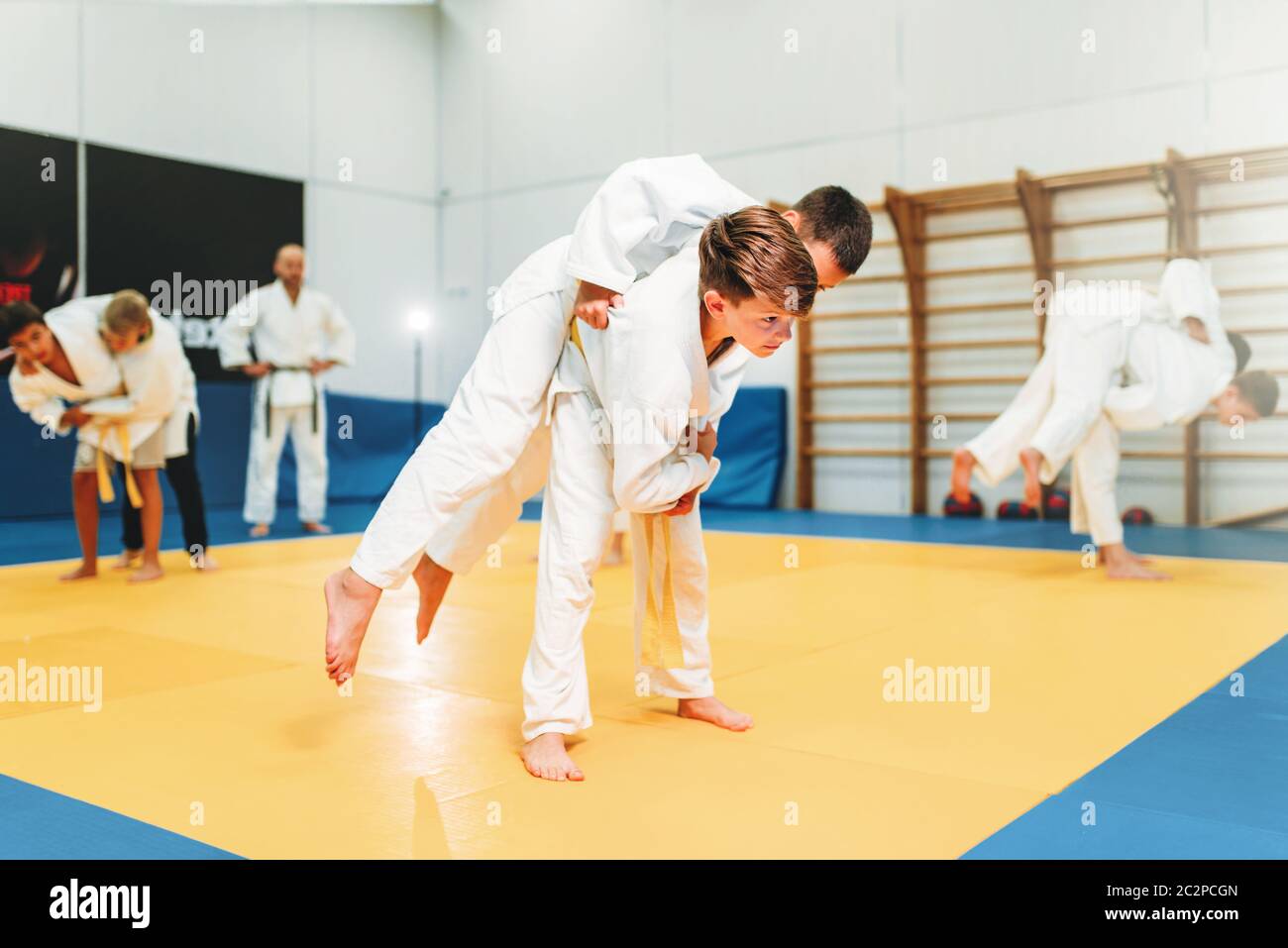 Kid judo, young fighters on training, self-defense. Little boys in ...
