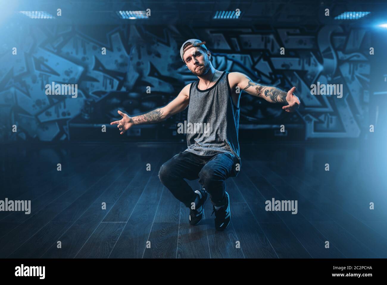 Male rapper in dance studio, trendy lifestyle. Modern urban dancing style Stock Photo - Alamy