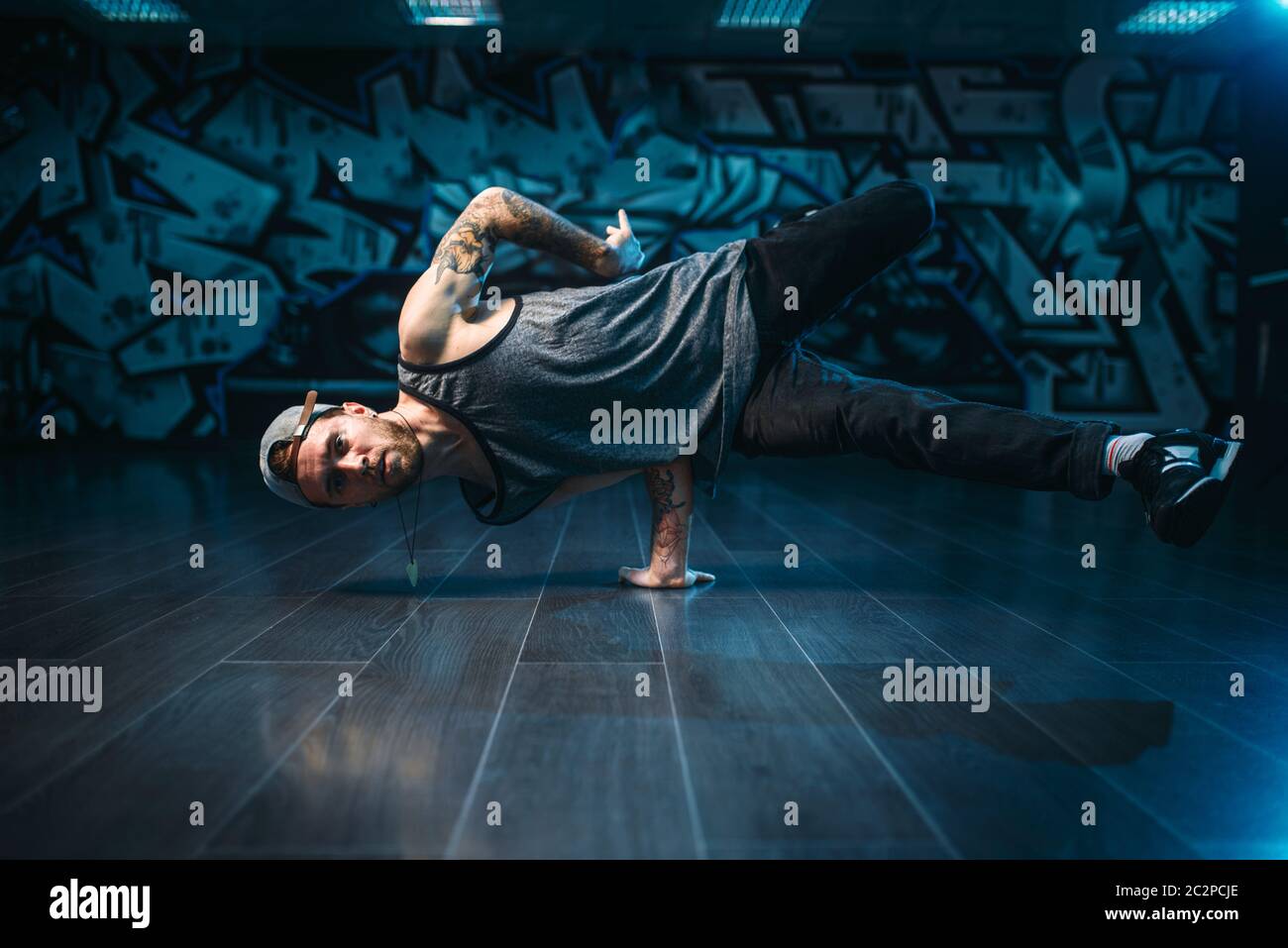 Hip hop action, male dancer motions in dance studio. Modern urban ...