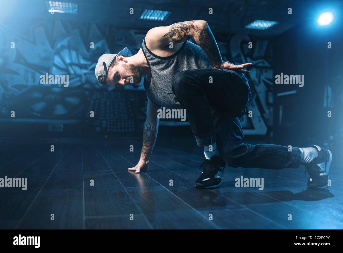 Breakdance motions, performer in dance studio. Modern urban dancing style Stock Photo - Alamy