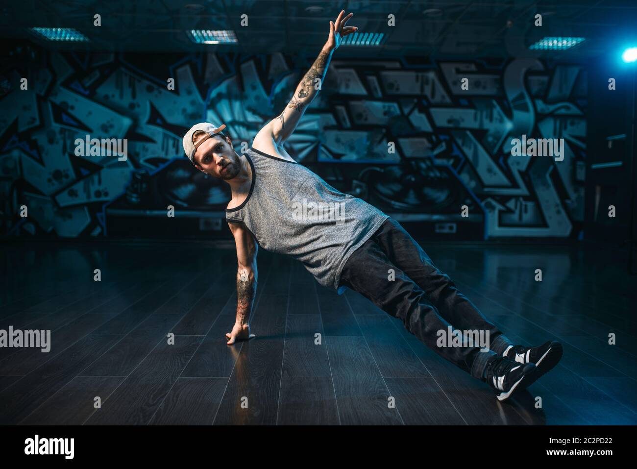 Male rapper in dance studio, trendy lifestyle. Modern urban dancing ...