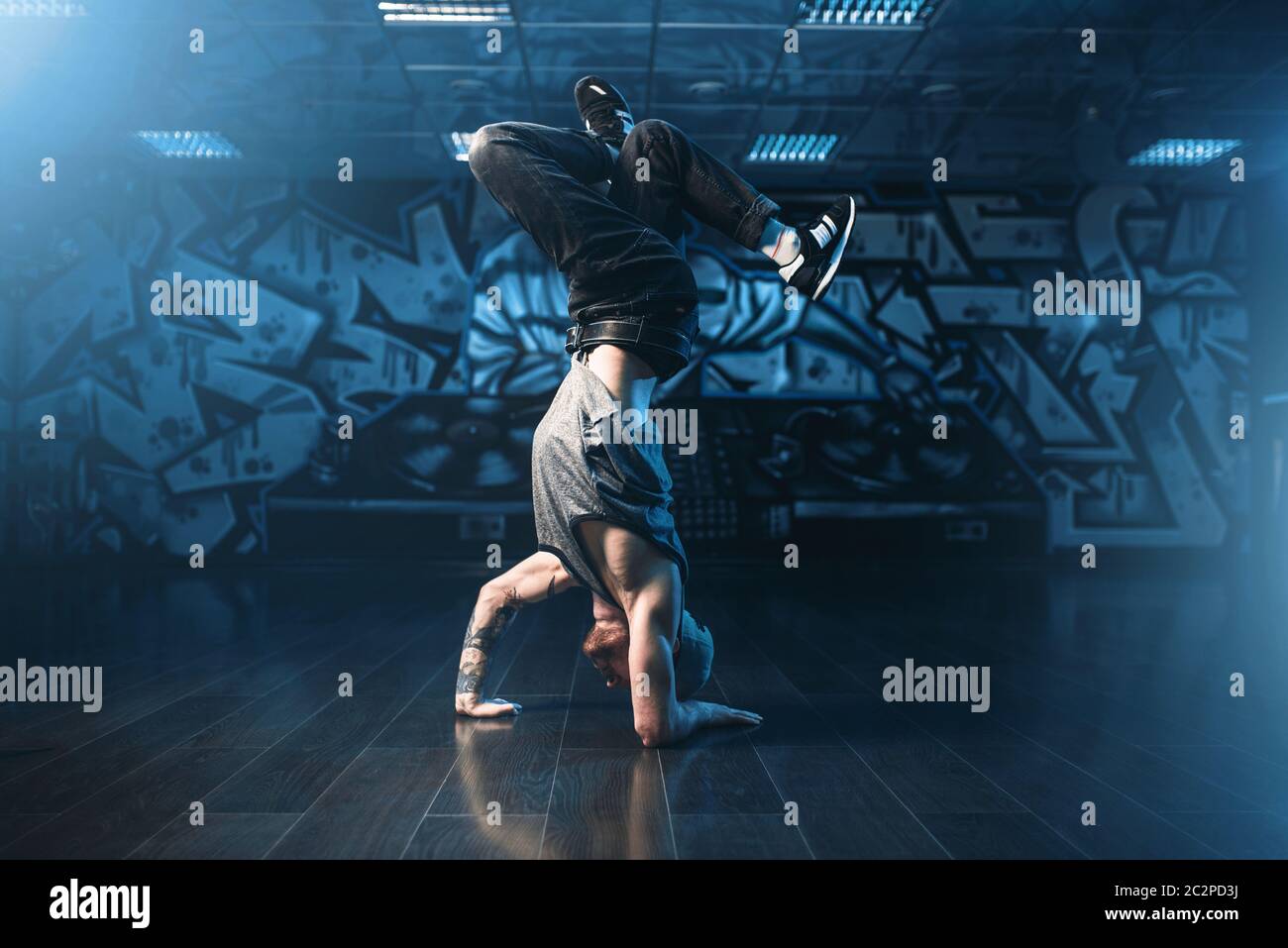 Breakdance motions, performer in dance studio. Modern urban dancing style Stock Photo - Alamy