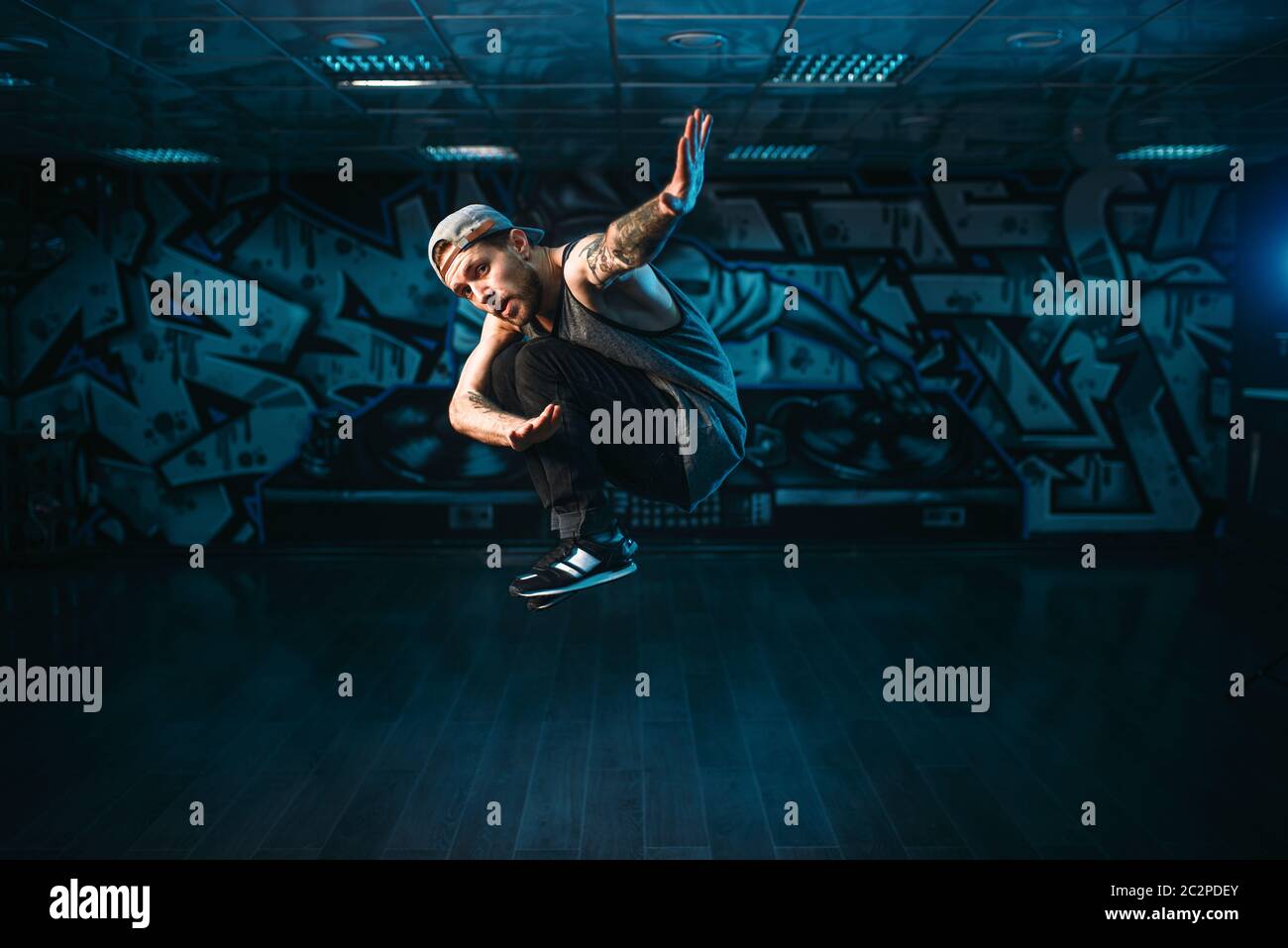Breakdance motions, performer in dance studio. Modern urban dancing style Stock Photo - Alamy