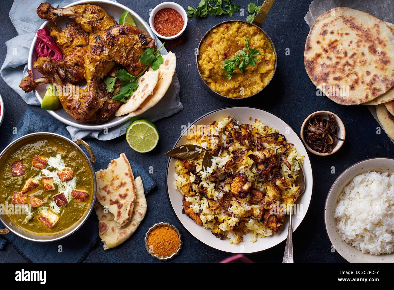 Indian cuisine dinner: tandoori chicken, biryani, red lentil curry dal ...