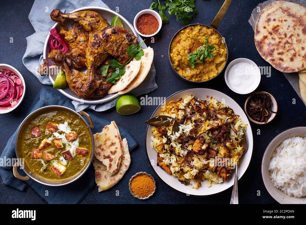 Indian cuisine dinner: tandoori chicken, biryani, red lentil curry dal ...