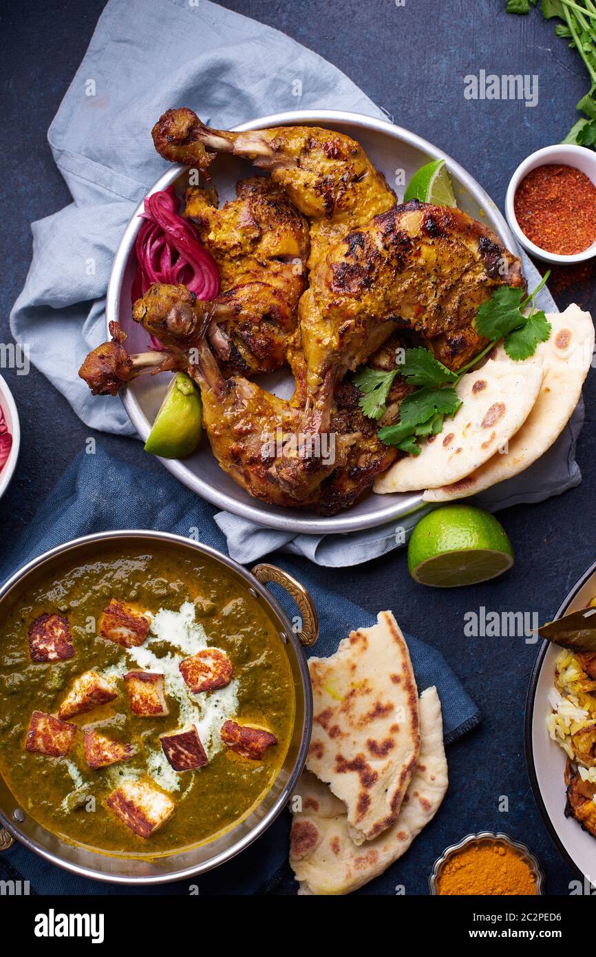 Indian cuisine dinner: tandoori chicken, biryani, red lentil curry dal ...