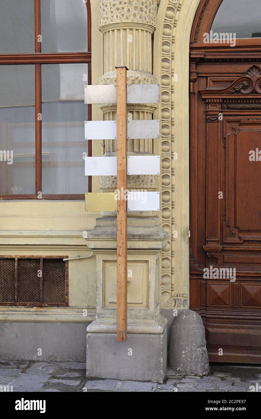 Wooden Sign Pole in Front of Building in Vienna Stock Photo - Alamy