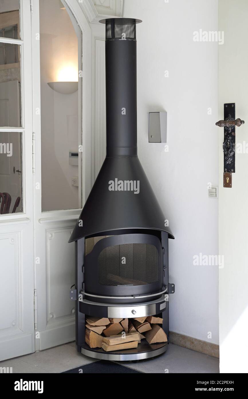 Modern Black Wood Burning Stove With Chimney Stock Photo - Alamy