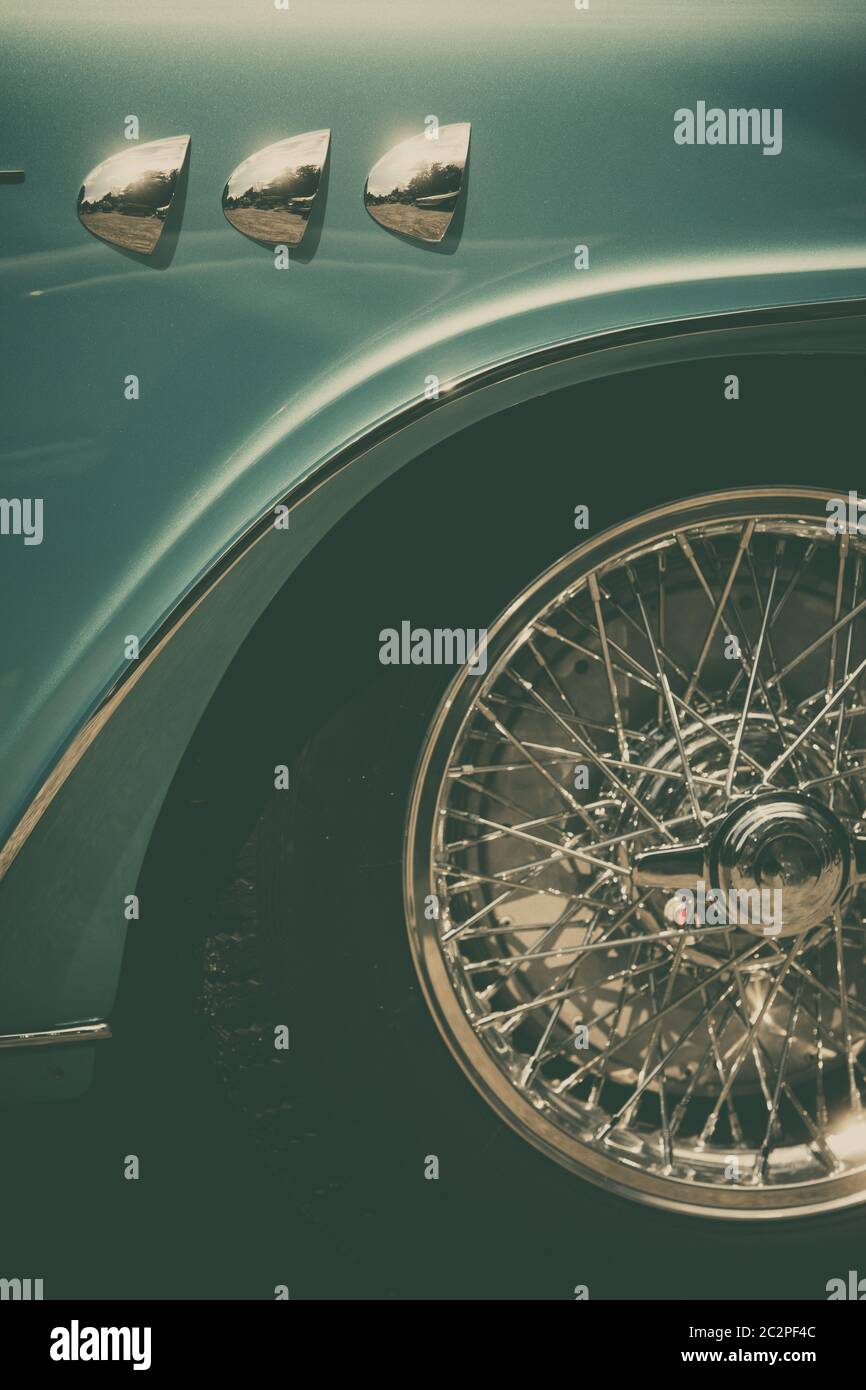 Close up shot of a vintage classic car wheel and air vents Stock Photo ...