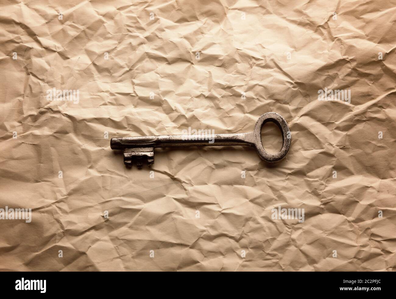 Ancient key on the old paper Stock Photo - Alamy
