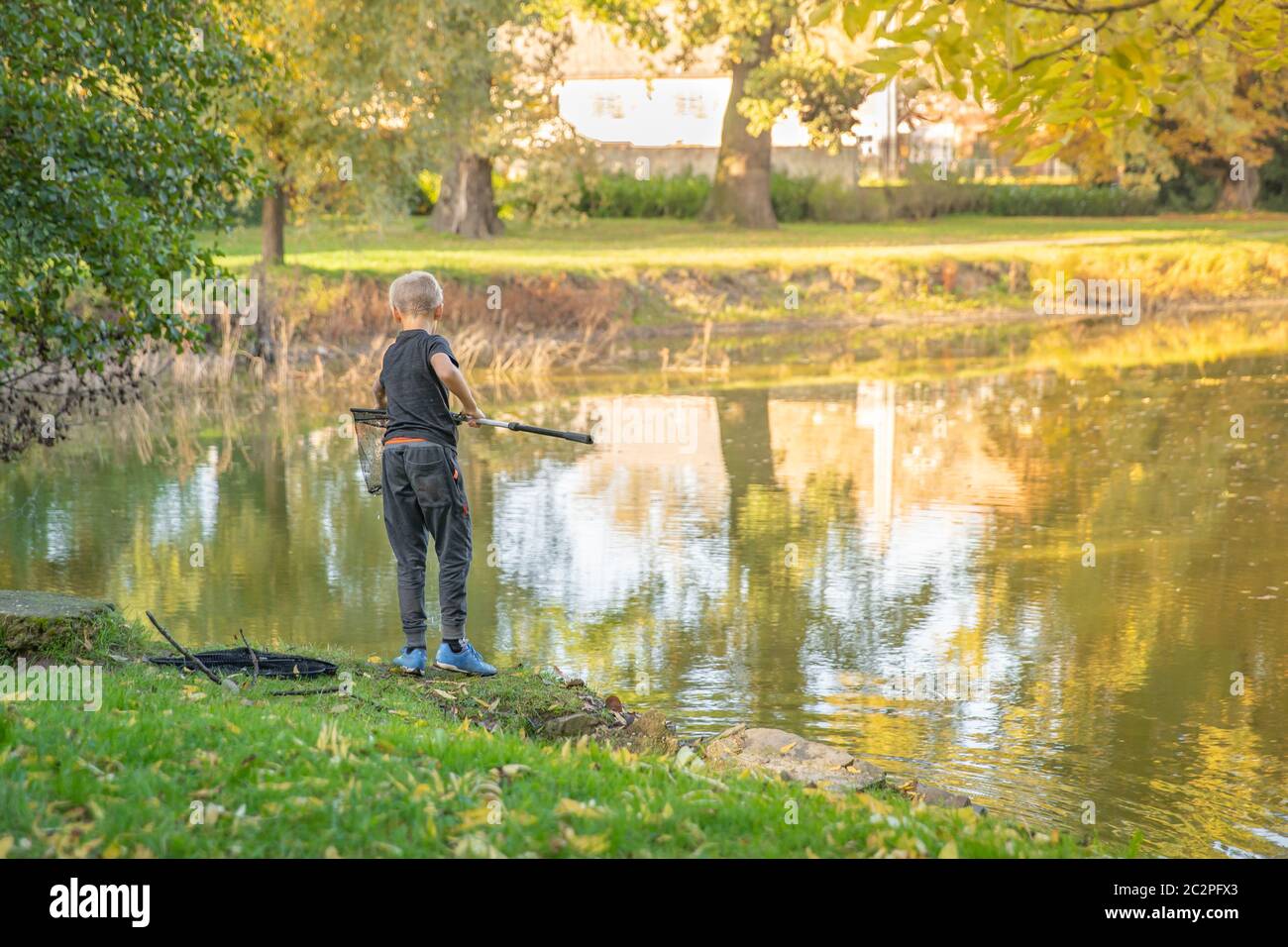 Angler teaching young to fish hi-res stock photography and images - Alamy