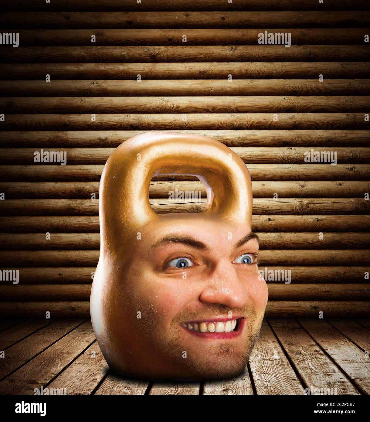 Kettlebell with male face in wooden room Stock Photo - Alamy