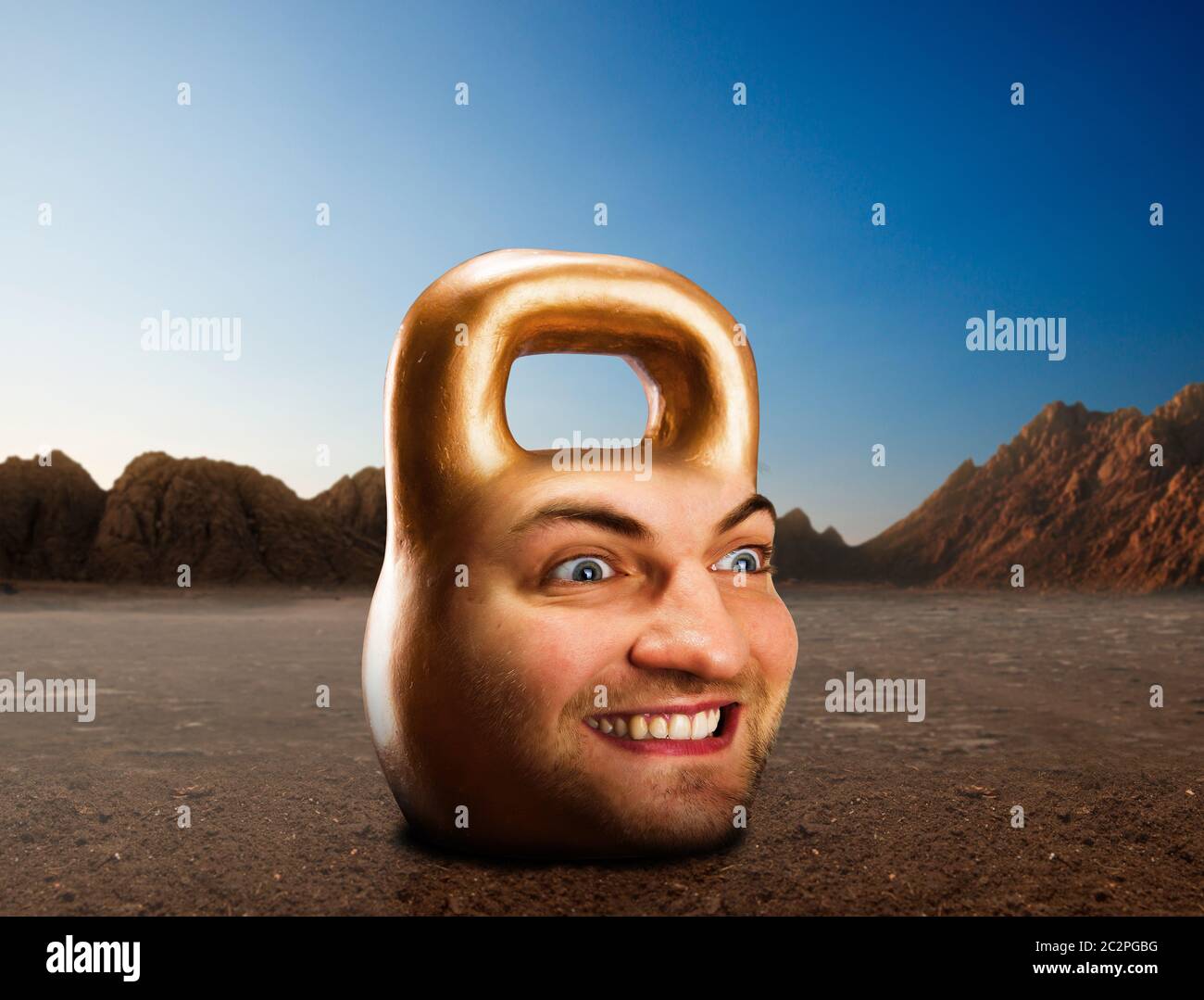 Kettlebell with male face in mountains Stock Photo - Alamy